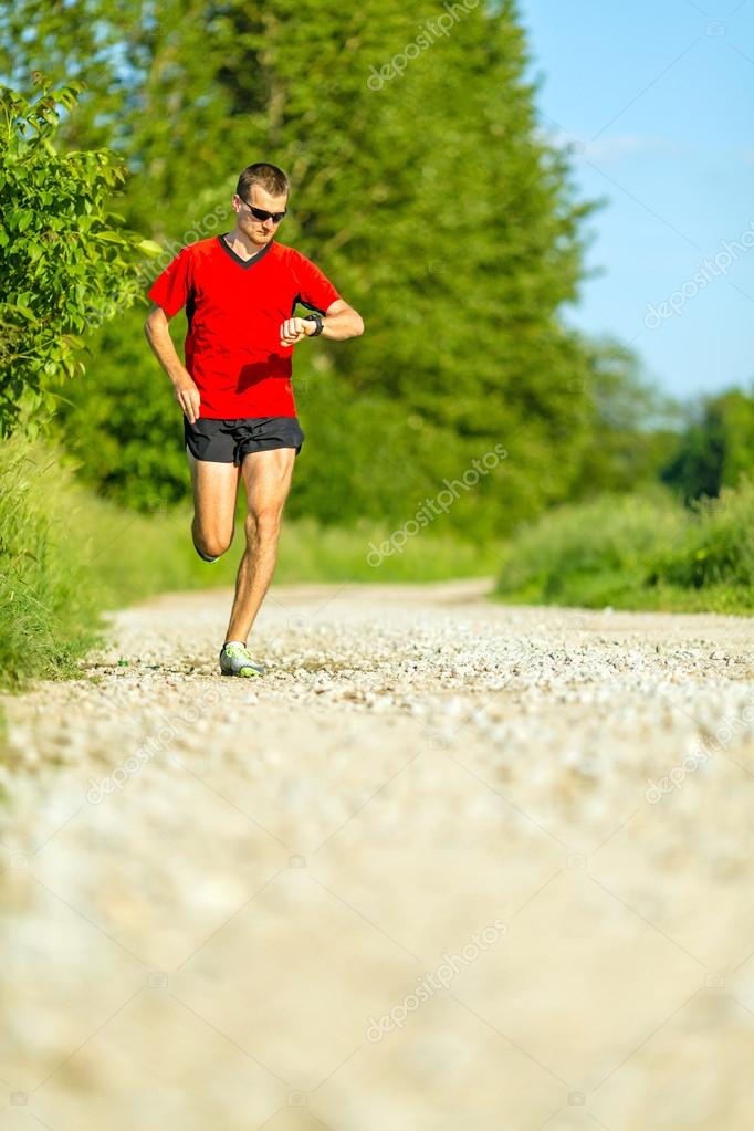 Man trail running on country road Stock Photo by ©blasbike 47191373