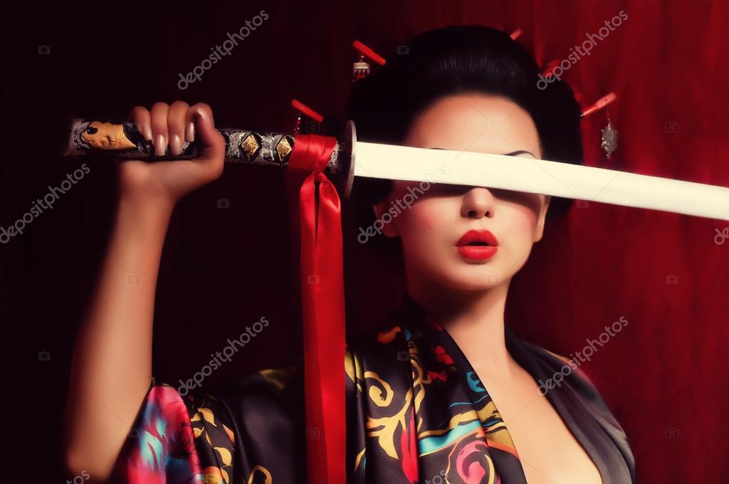 Beautiful geisha in kimono with samurai sword — Stock Photo © Forewer ...