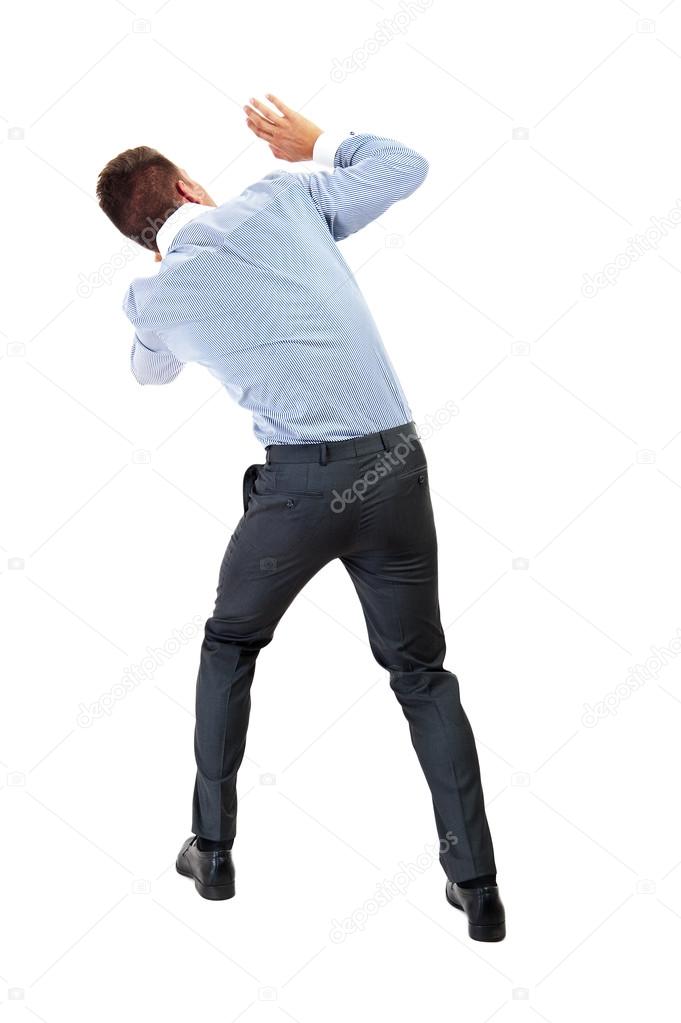 Back view of shocked and scared young business man. Holds hands Stock ...