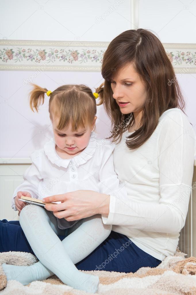 Mother and child reading book Stock Photo by ©bdibdus 22205933