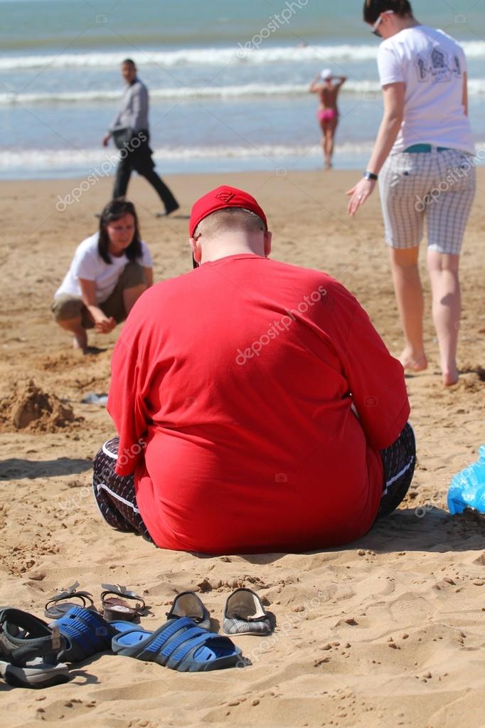 Overweight Man On Beach
