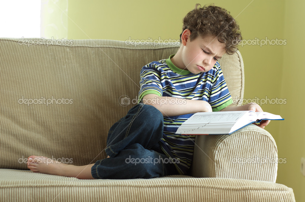 Young boy reading a book Stock Photo by ©gbh007 32665091