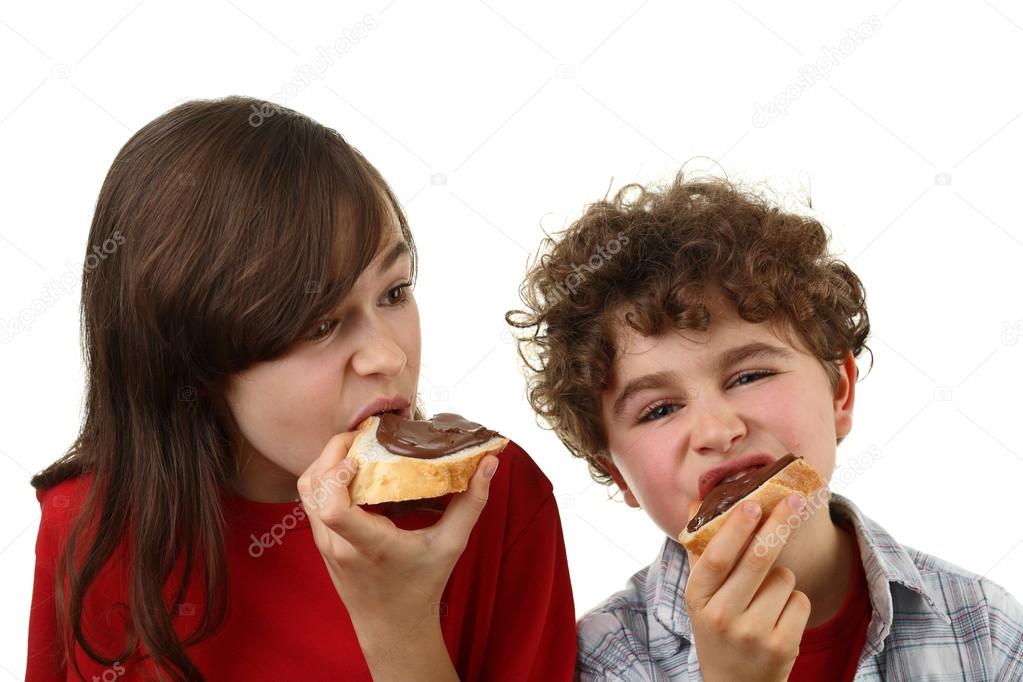 Kids eating bread with nut butter Stock Photo by ©gbh007 32755749
