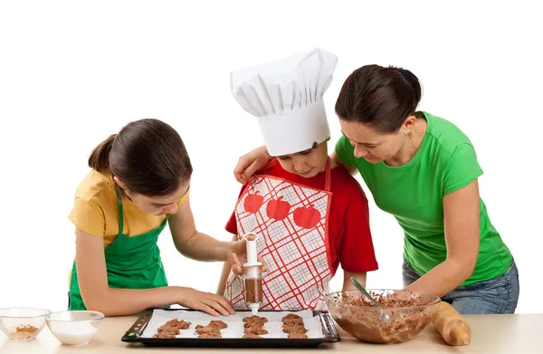 Mom with kids making cakes Stock Photo by ©gbh007 32830753