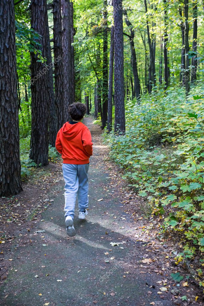 Teenage boy running in park — Stock Photo © gbh007 #46264917
