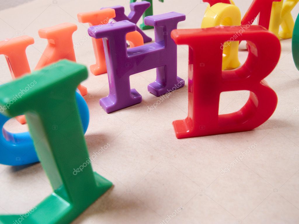 Plastic color alphabet letters Stock Photo by ©strelok 23161060