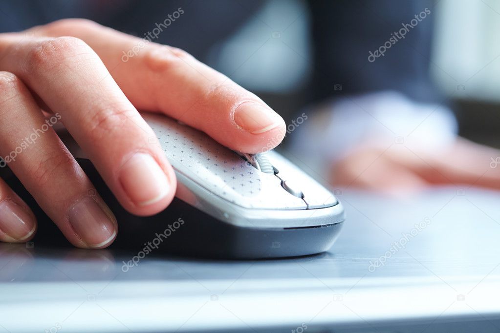 Female hand clicking computer mouse Stock Photo by ©strelok 48622033