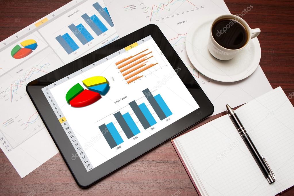 Digital tablet showing charts and diagram Stock Photo by ©REDPIXEL 26267109
