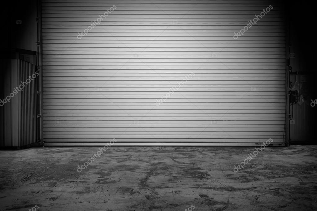 Building with roller shutter door Stock Photo by ©REDPIXEL 33439087