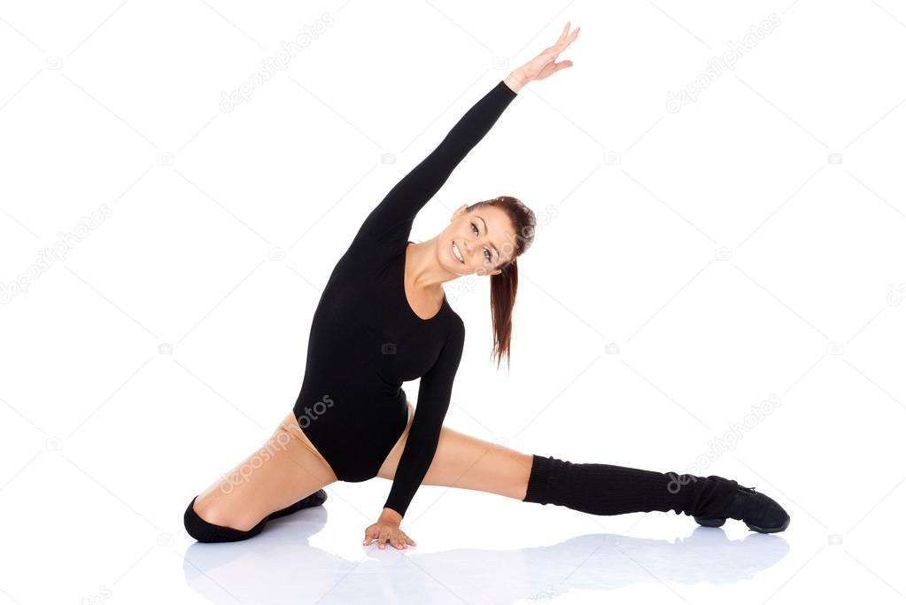 Happy young girl doing stretching Stock Photo by ©dashek 32672521