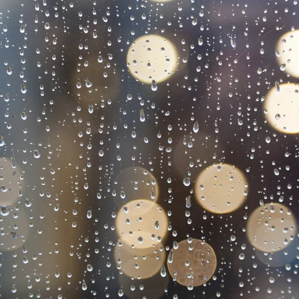 Rain on window with abstract lights - Stock Image - Everypixel