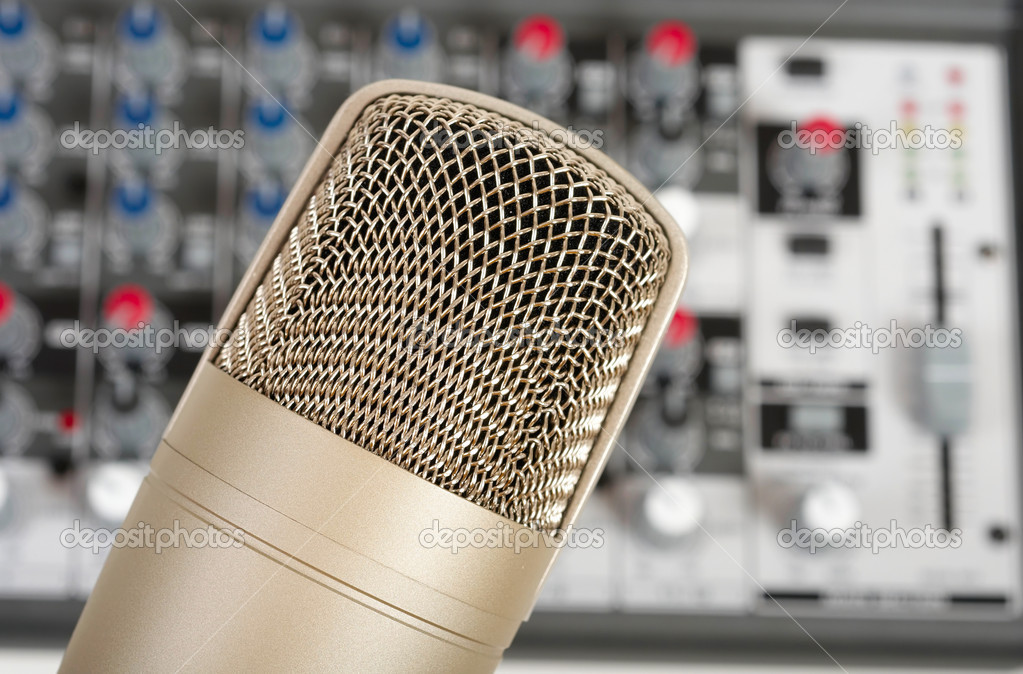 Studio microphone on the audio control console background Stock Photo ...