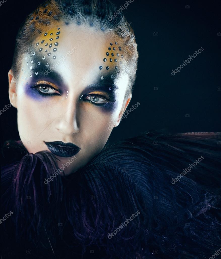 Cre ative face paint portrait.Young beautiful fashion model with ...