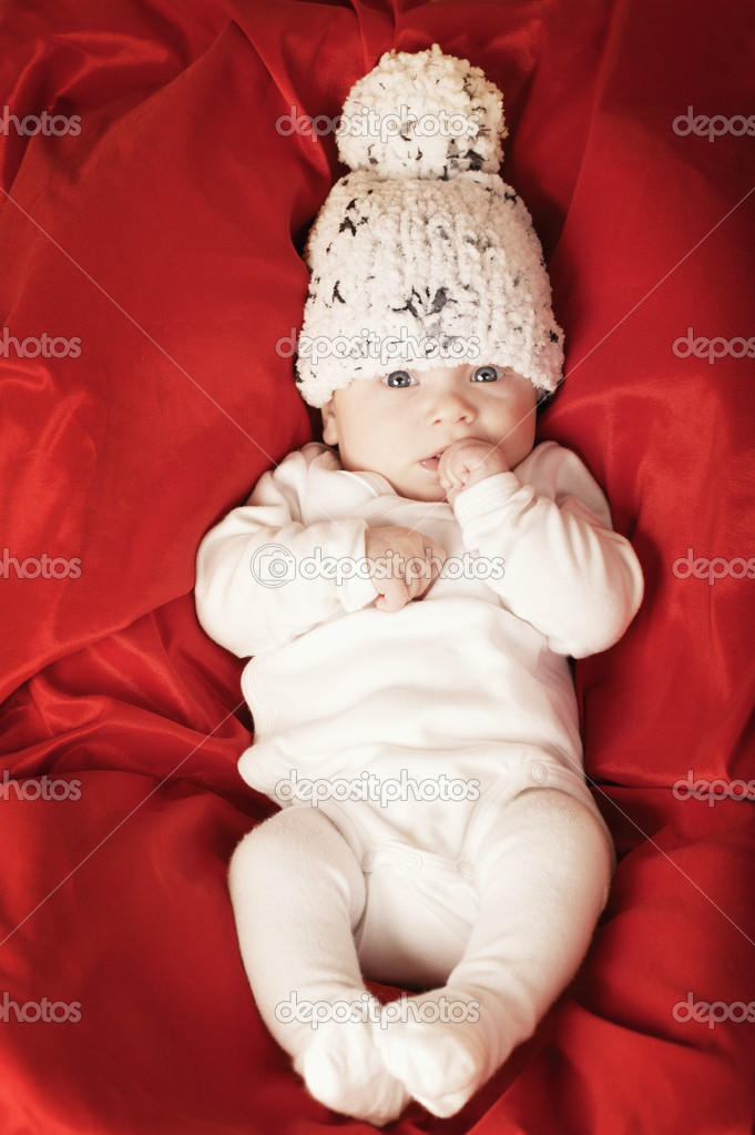 Cute baby on red backround — Stock Photo © ababaka #33261655