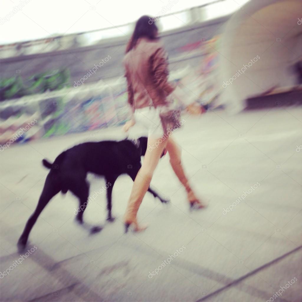 Girl with a dog. – Stock Editorial Photo © morozzz #31461121