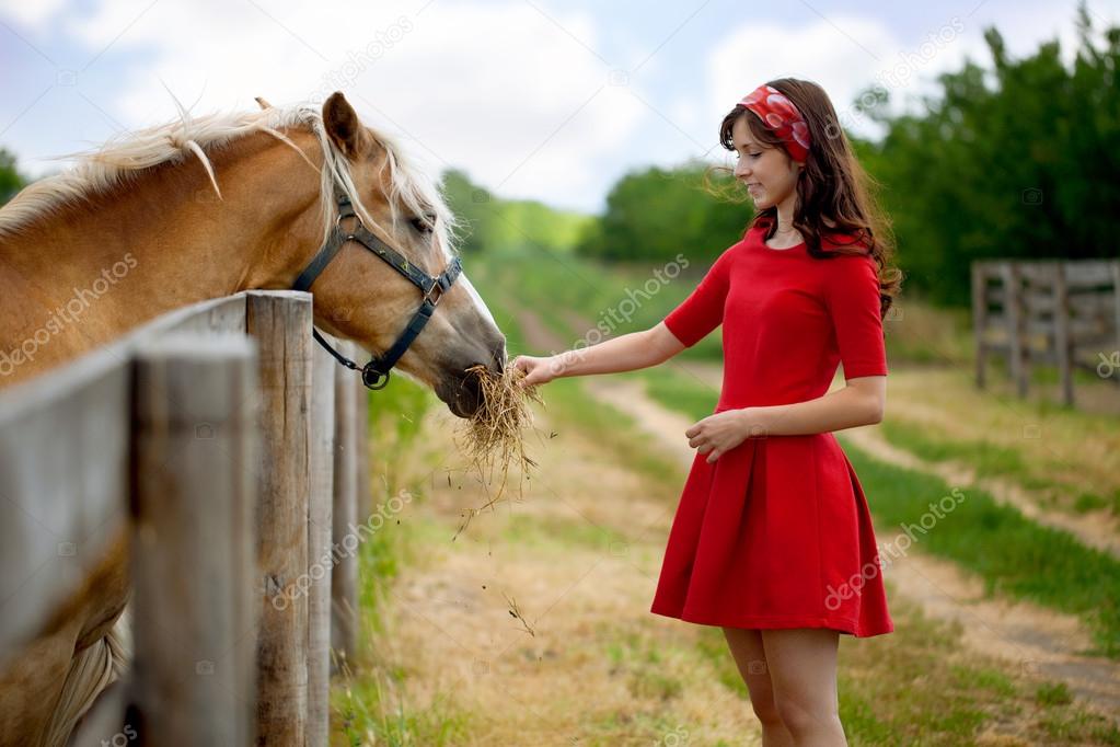 Girl Feeding Her Horse