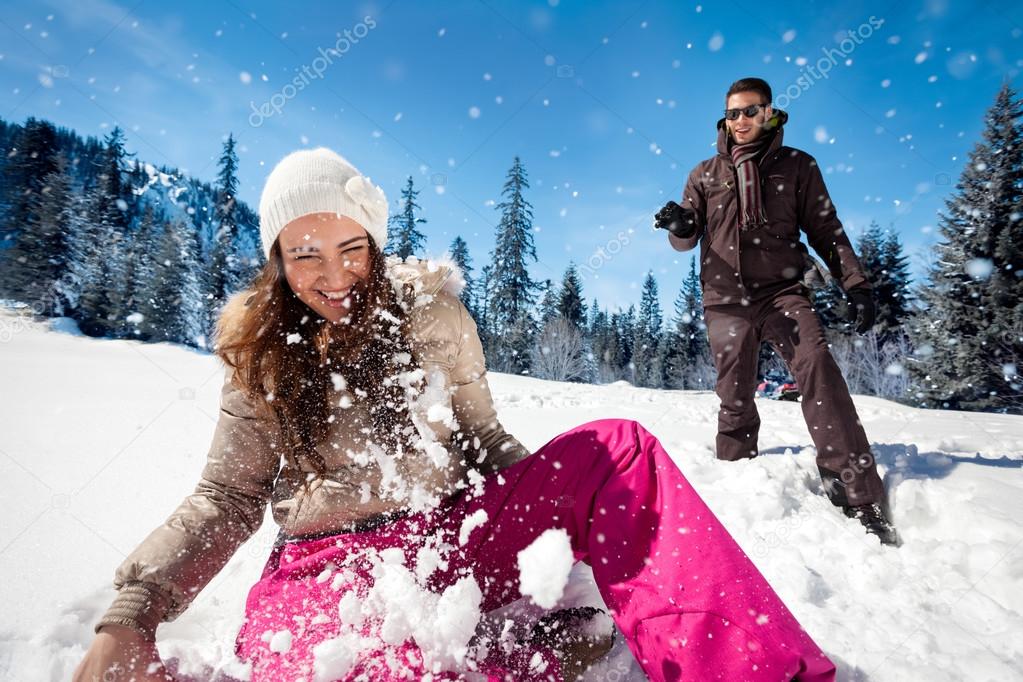 Couple playing in snow — Stock Photo © luckybusiness #35595681