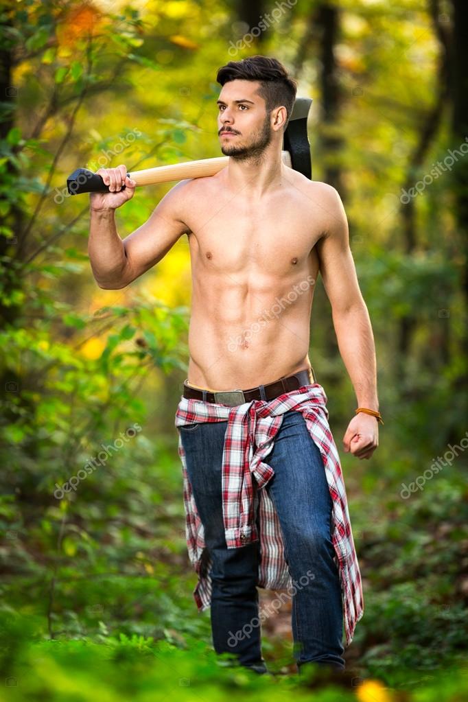 Muscled man with axe Stock Photo by ©luckybusiness 46651443