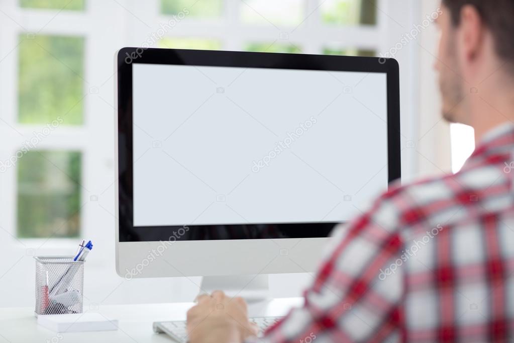 Man in front of computer screen Stock Photo by ©luckybusiness 50728209