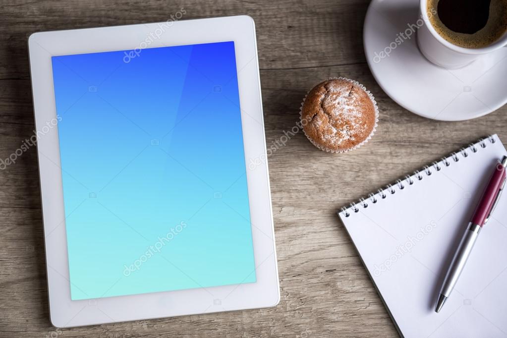 Ipad Tablet with cup of coffee over wooden table — Stock Photo ...
