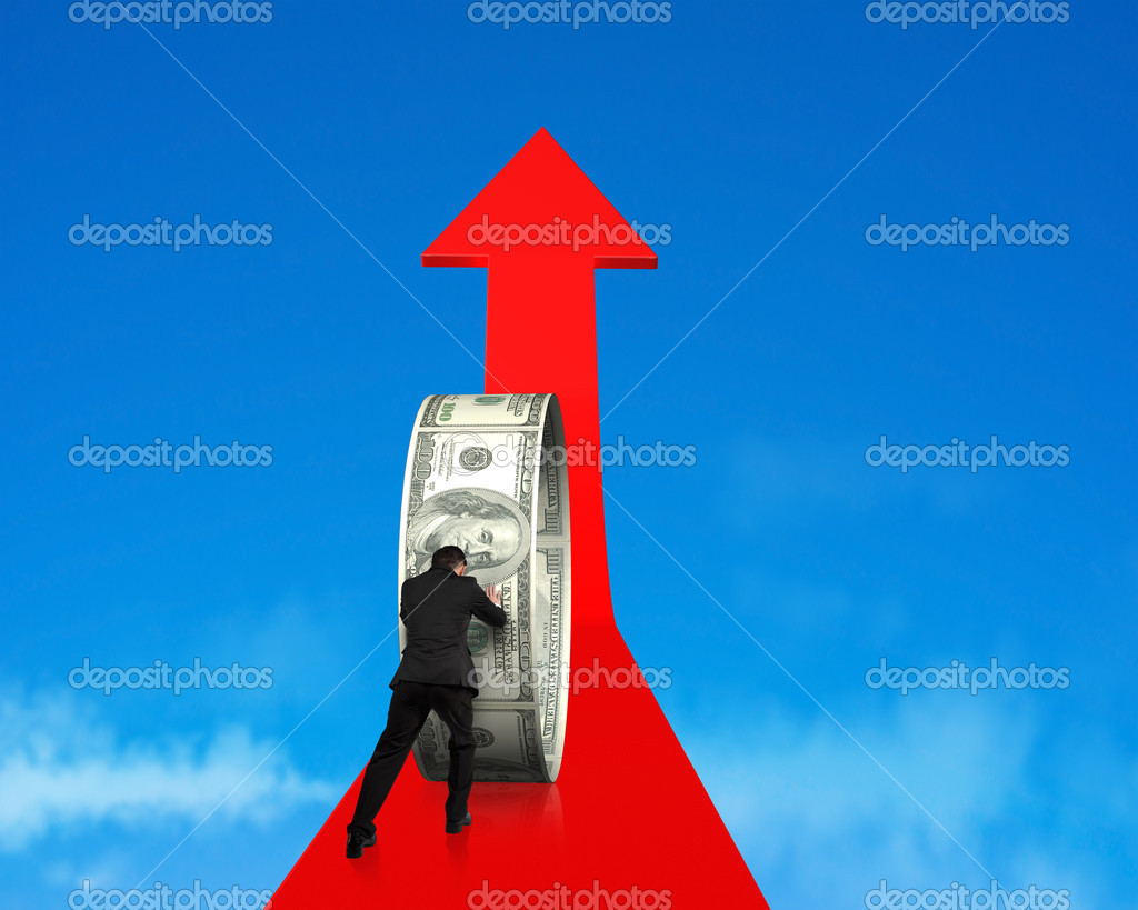 Businessman pushing money circle on growing red arrow with sky Stock ...