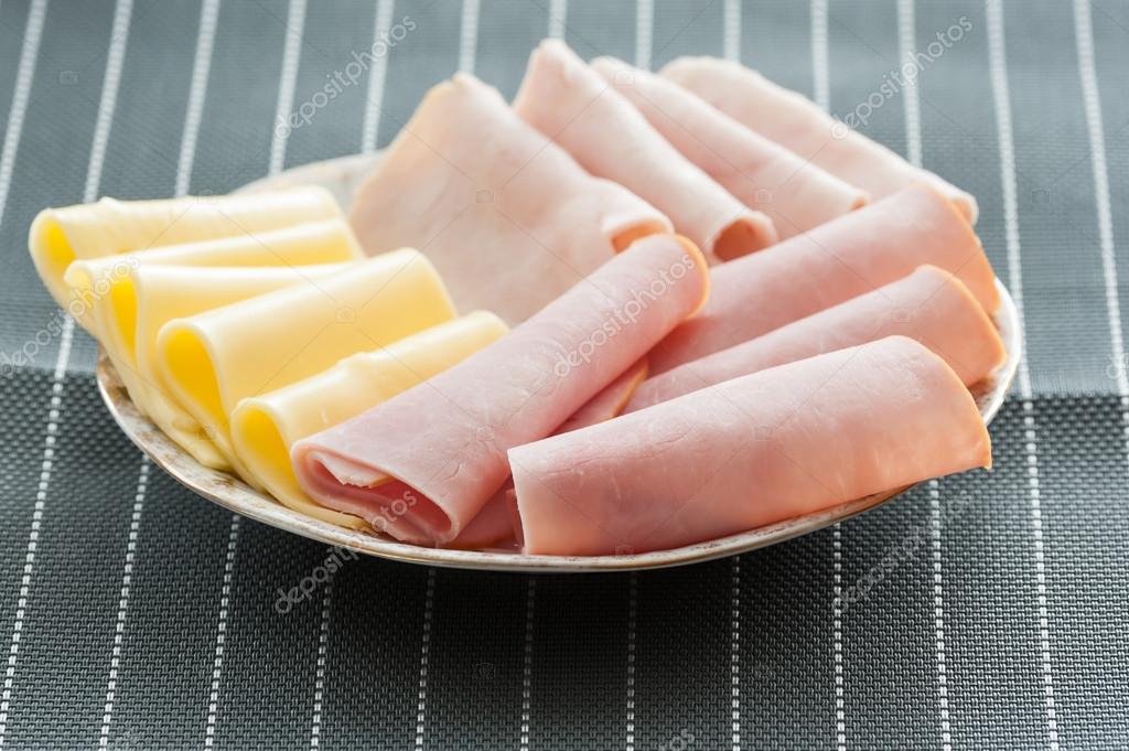 Slices of ham and cheese on plate — Stock Photo © rlat28 #32522821