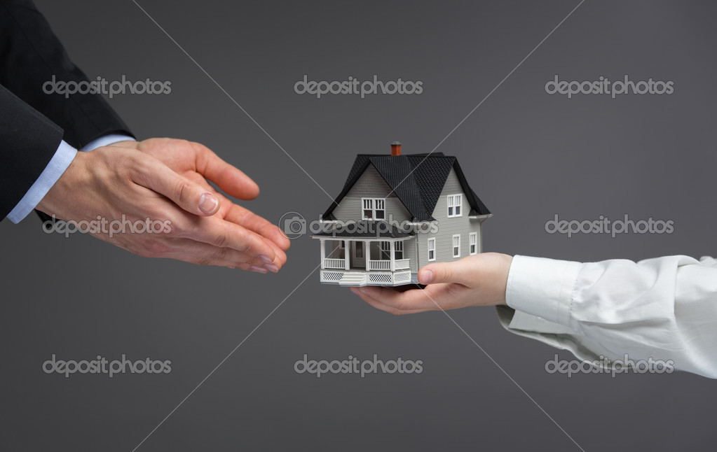 Hands giving house model Stock Photo by ©agencyby 36535925