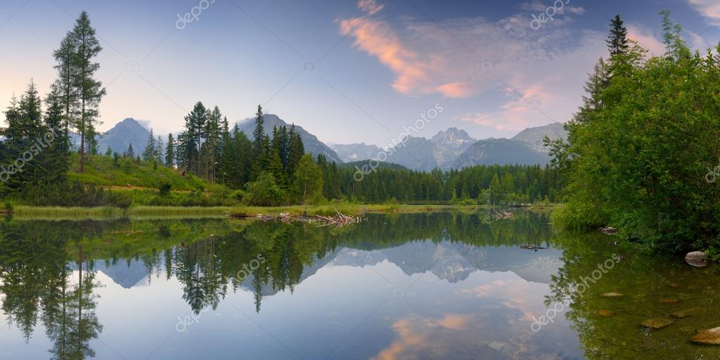 Lake is surrounded by mountains Stock Photo by ©Kotenko 29569415
