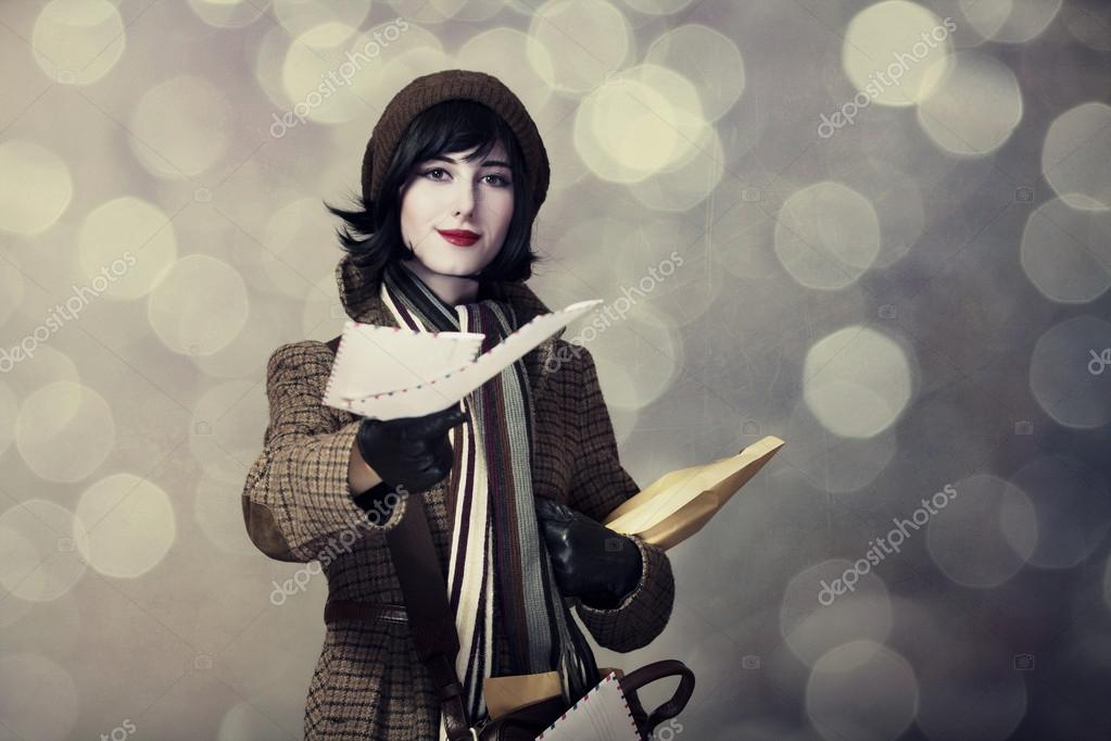Young postman girl with mail. Photo in old color style with boke Stock ...