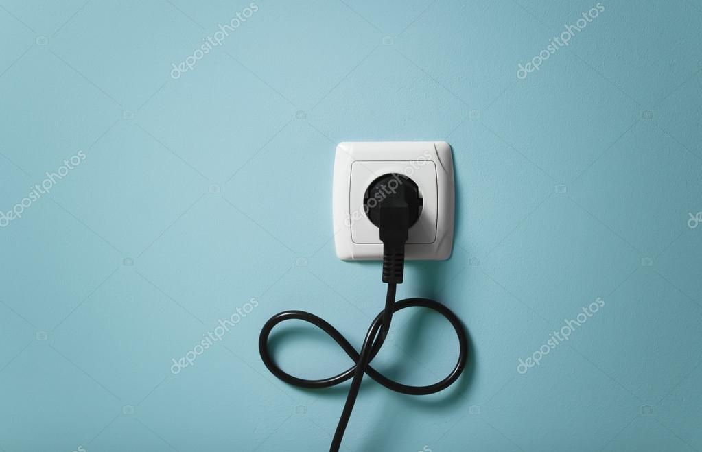 Electrical cable into the socket in infinity symbol. — Stock Photo ...