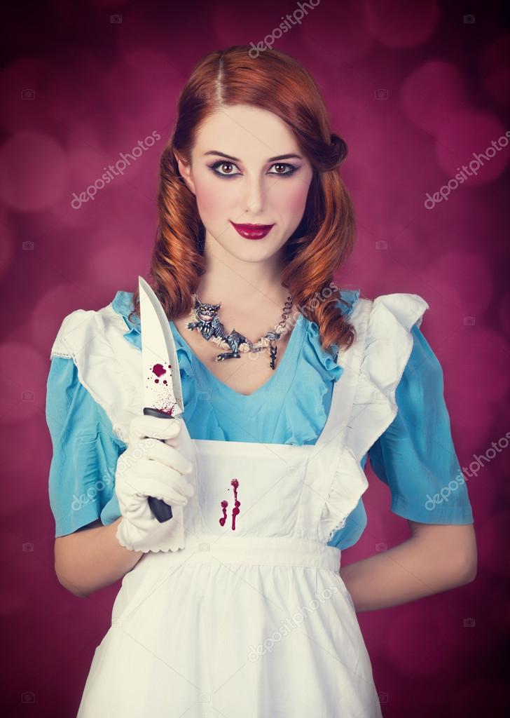 Portrait Of A Young Redhead Woman Dressed As Alice In Wonderland Stock