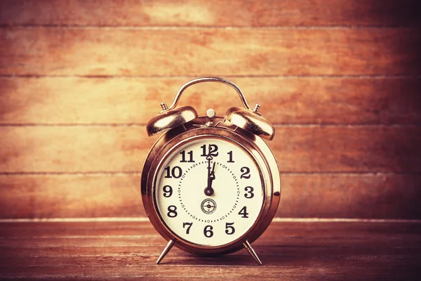 Retro alarm clock on a table. Stock Photo by ©massonforstock 38249319
