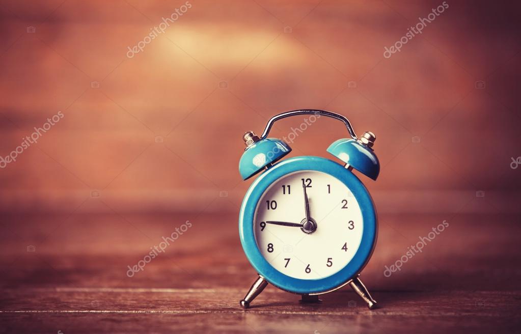 Retro alarm clock on a table — Stock Photo © massonforstock #38249481