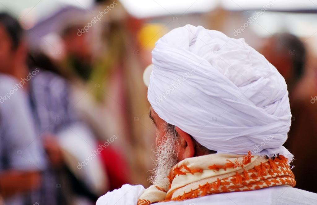 Arabic man with turban at islamic Fair — Stock Photo © inaquim #25838873