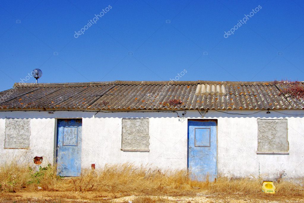 Abandoned facade ,no windows,blue doors in Portugal Stock Photo by ...