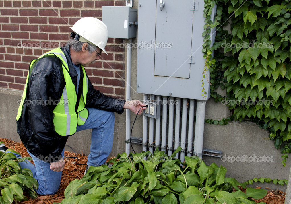 Electrician checking power — Stock Photo © dcwcreations #32443997