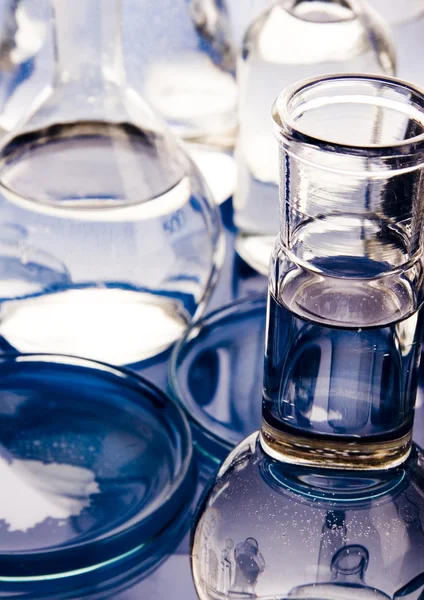 Laboratory vessels on table Stock Photo by ©TunedIn61 85073010