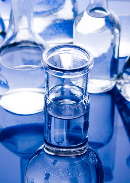 Laboratory vessels on table Stock Photo by ©TunedIn61 85073010