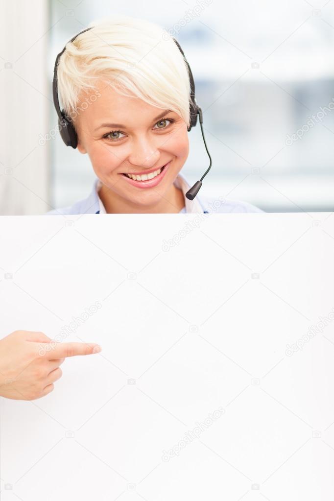 Support assistant indicating with finger on a banner — Stock Photo ...