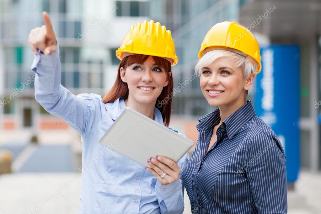 Female constructors are discussing their project Stock Photo by ...