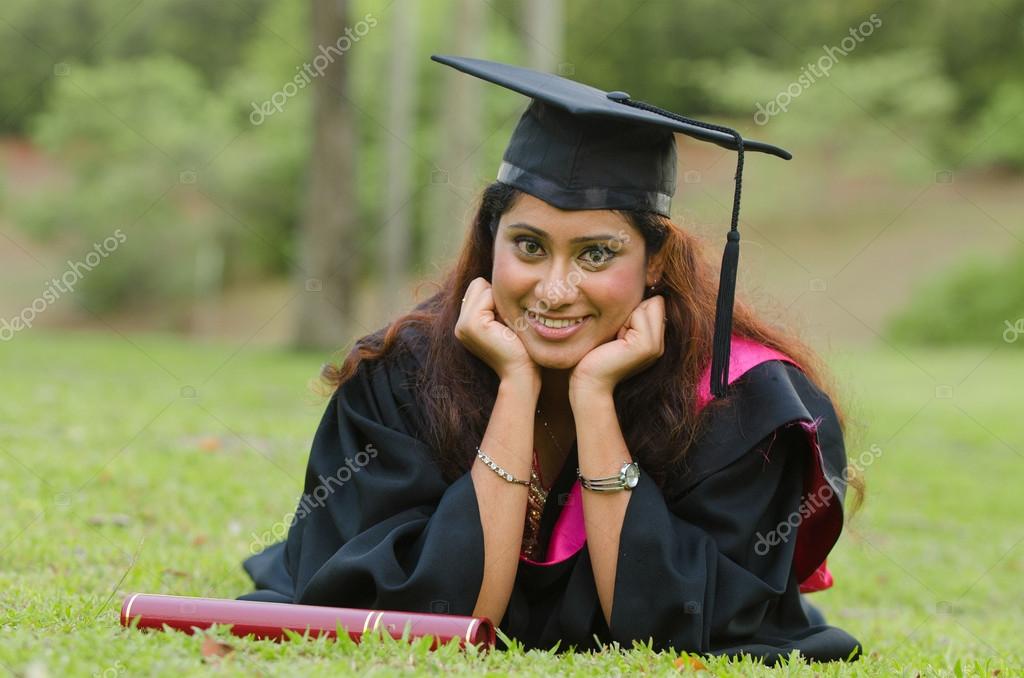 Indian female graduate with green background Stock Photo by ©yuliang11 ...