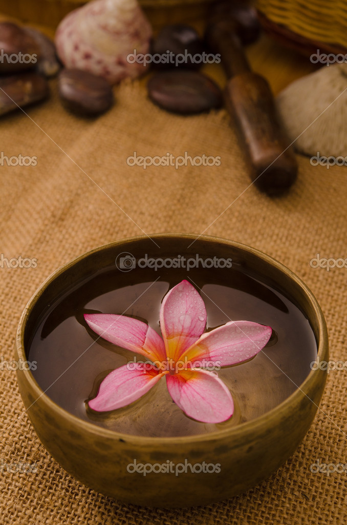 Tropical spa setup with traditional frangipani flower and massag Stock ...