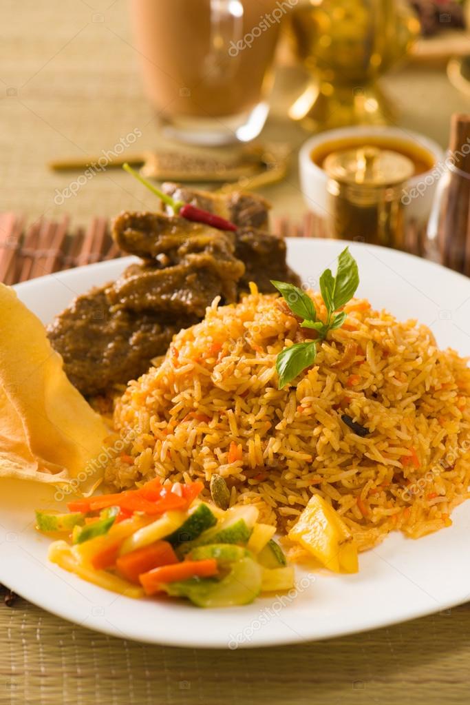 Biryani rice with traditional items on background Royalty Free Photo ...