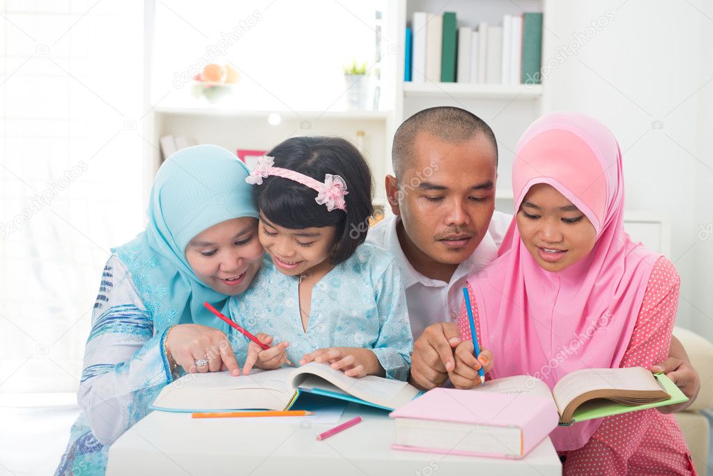 Indonesian muslim family learning together Stock Photo by ©yuliang11 ...