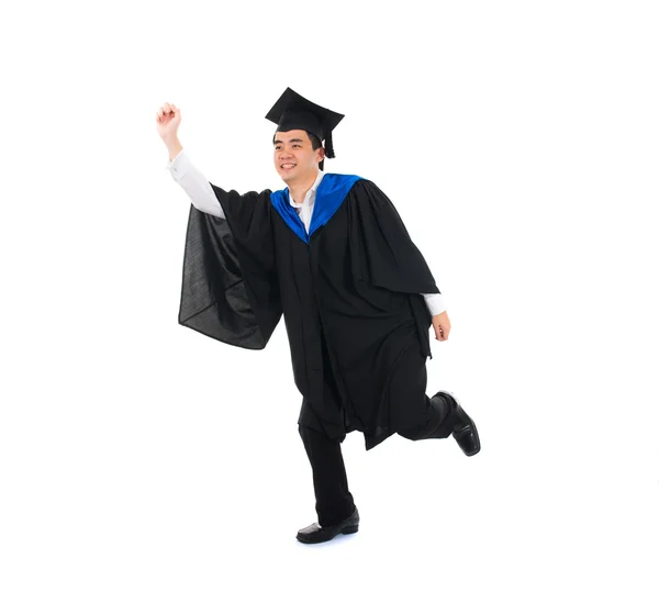 Male graduate student jumping — Stock Photo © ljsphotography #46591215