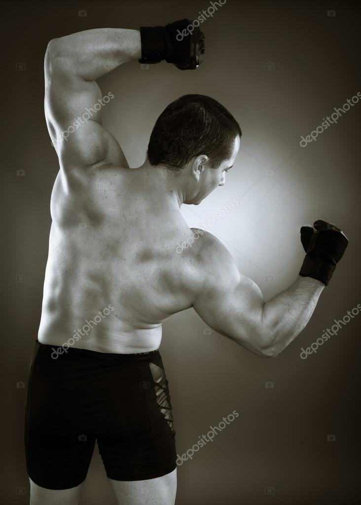 Bodybuilder back Stock Photo by ©Xalanx 43138785