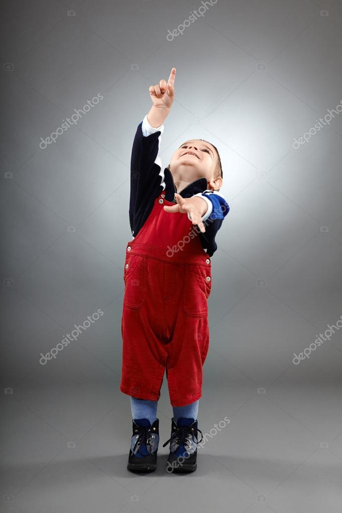 Kid pointing up Stock Photo by ©Xalanx 47833495