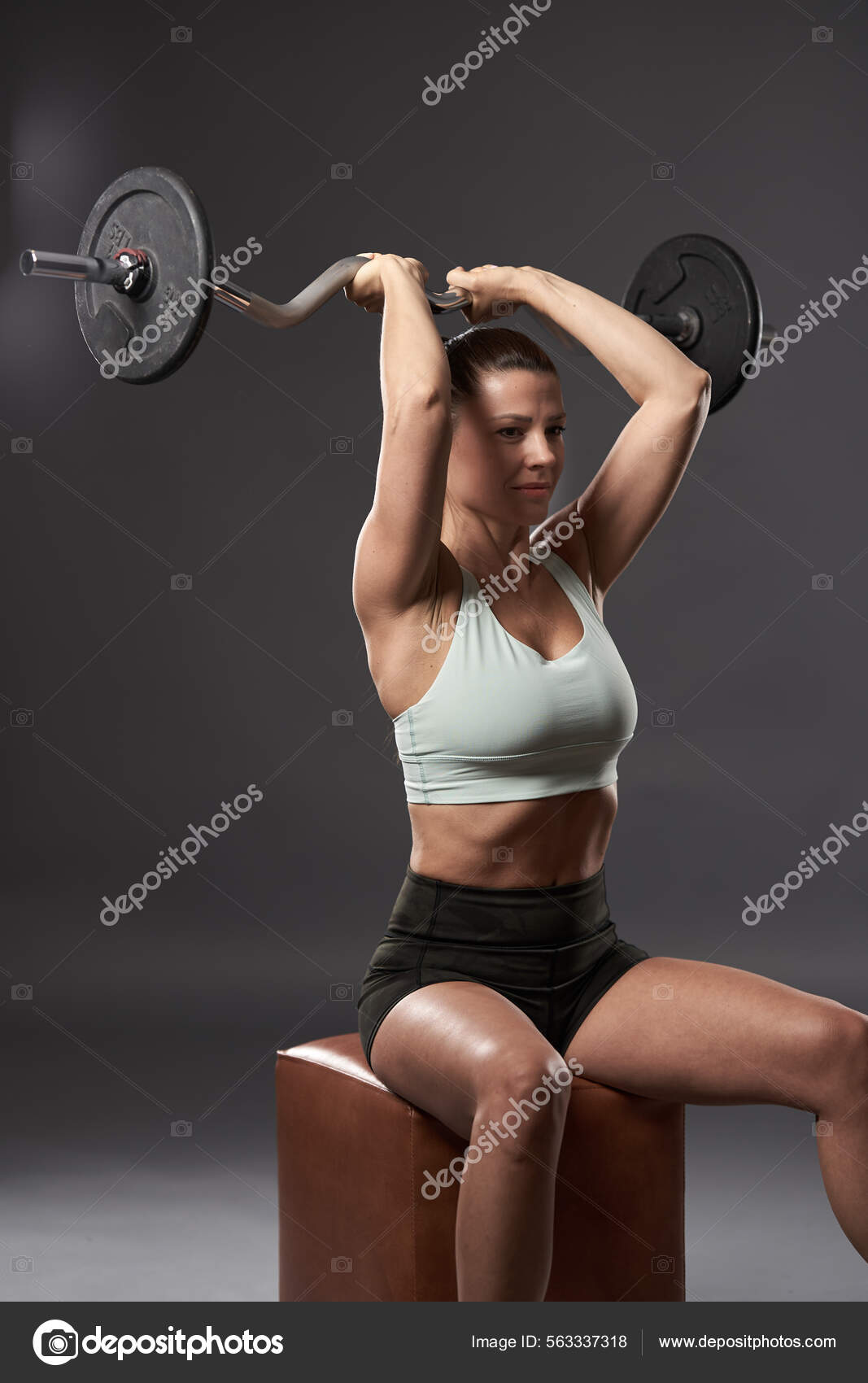 Woman Doing Triceps Workout Barbell Isolated Gray Background — Stock Photo © Xalanx #563337318