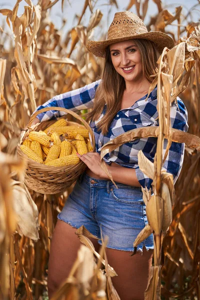 Happy plus size beautiful farmer woman with a basket, in plaid jeans ...