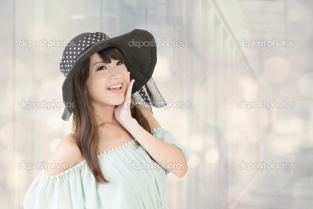 Elegant asian woman with hat Stock Photo by ©elwynn 30708969